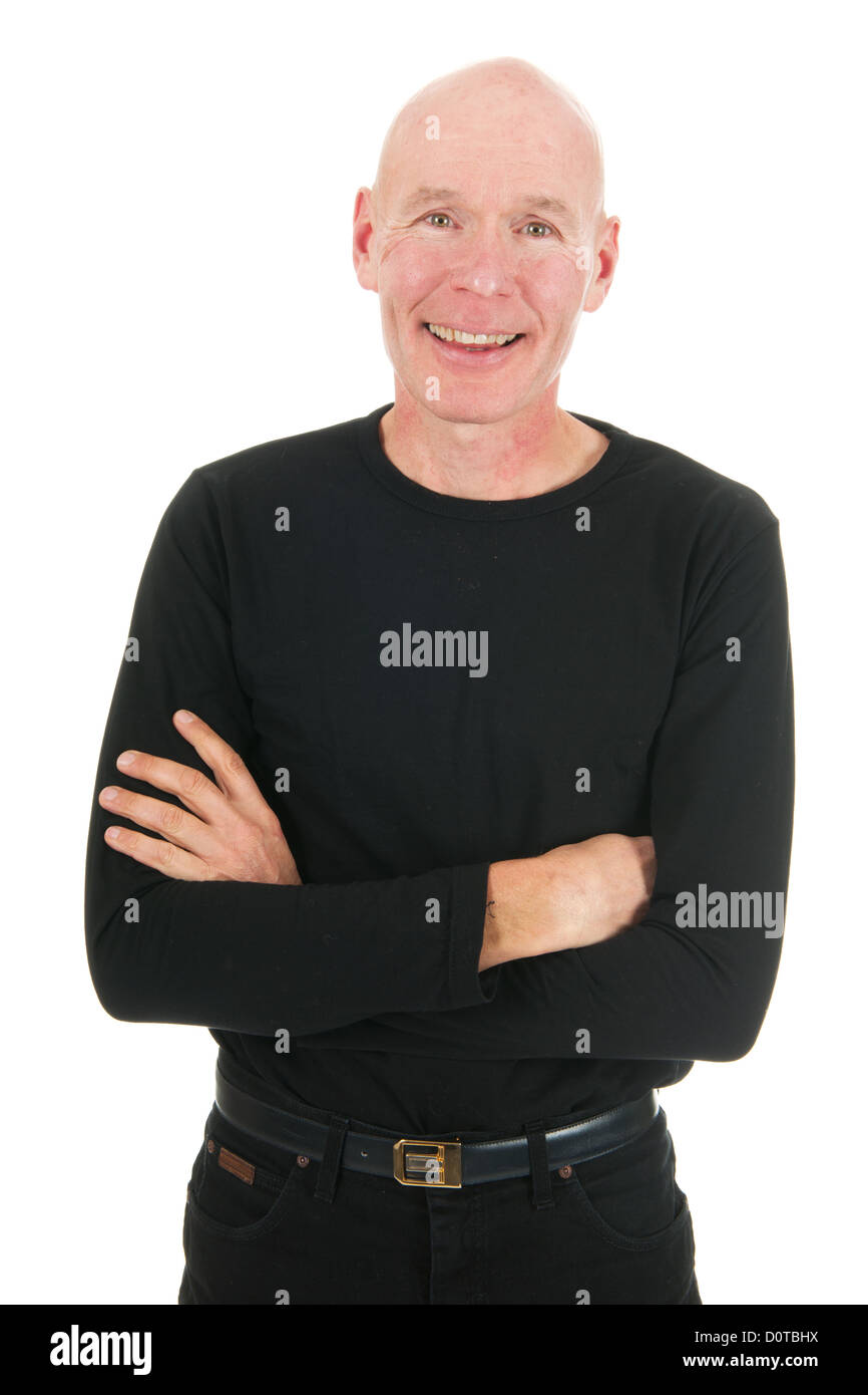 Adult bald man dressed in black standing in the studio Stock Photo - Alamy