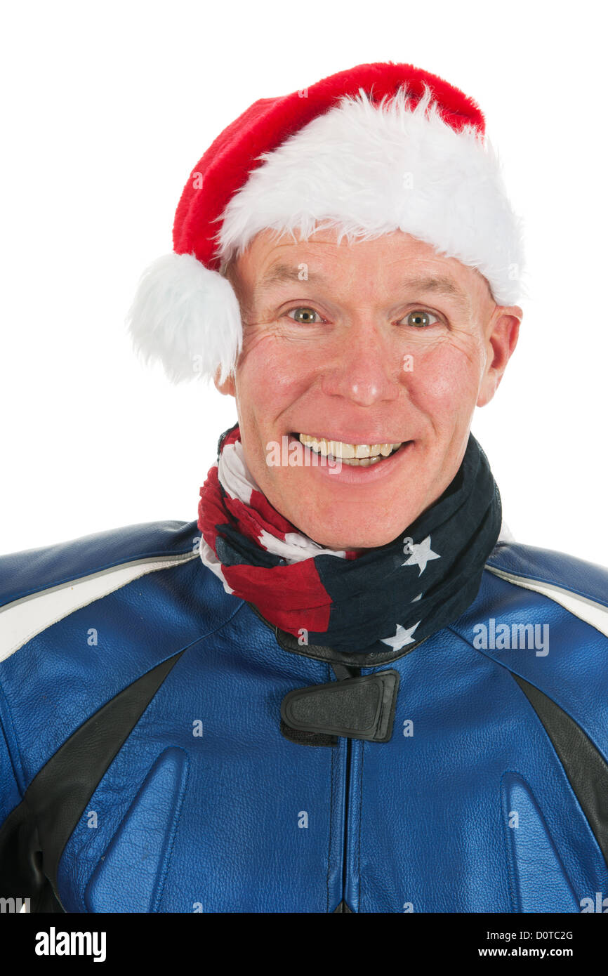 Portrait of a adult motor biker with hat of Santa Claus isolated over ...