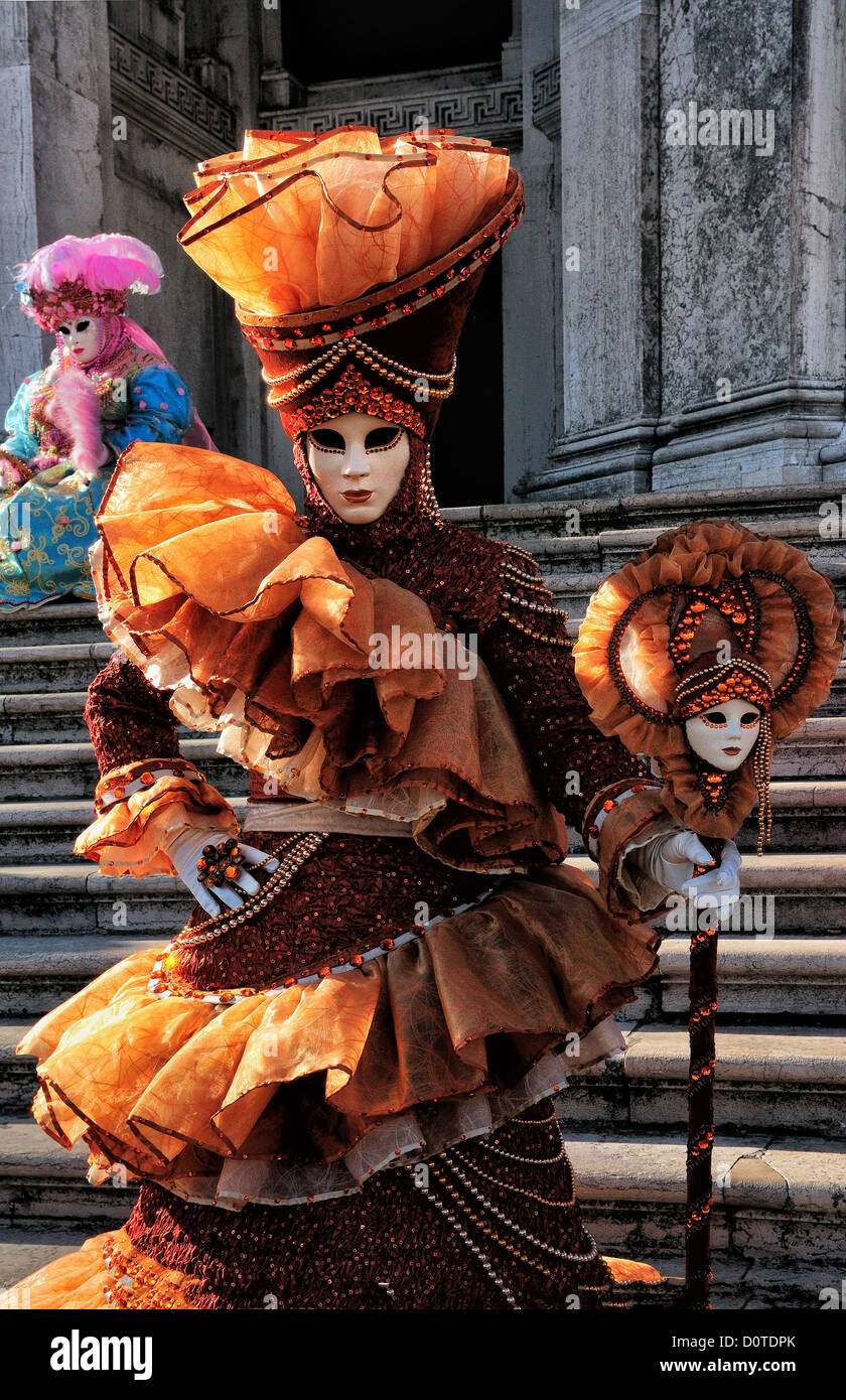 Masked woman on the steps of the Basilica di Santa Maria della Salute ...