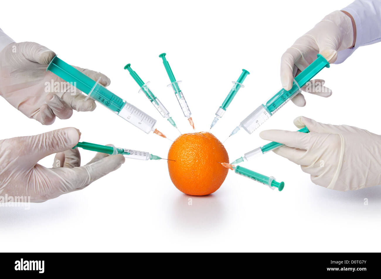 Science experiment with orange and syringe Stock Photo - Alamy