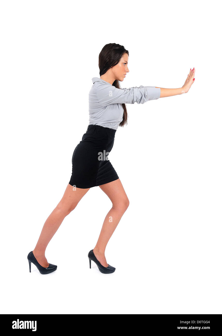 Attractive businesswoman pushing something hi-res stock photography and ...