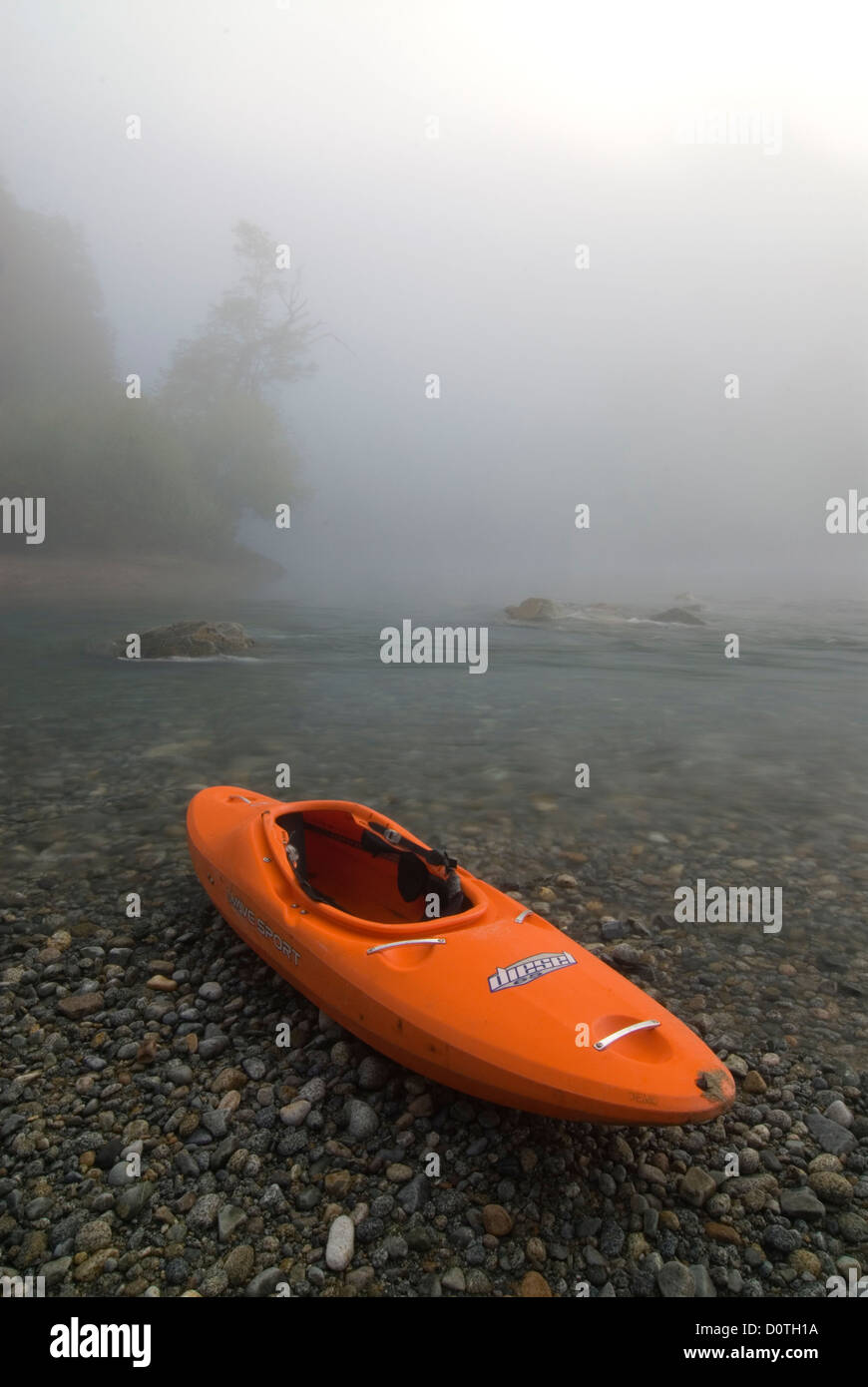 Kayak in the morning mist at the confluence of the Rio Azul and ...