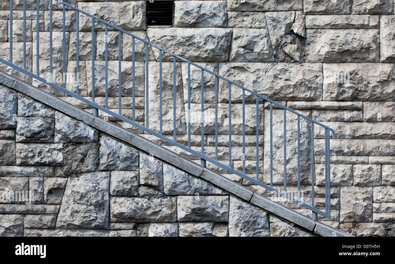 stone wall with blue railings Stock Photo - Alamy