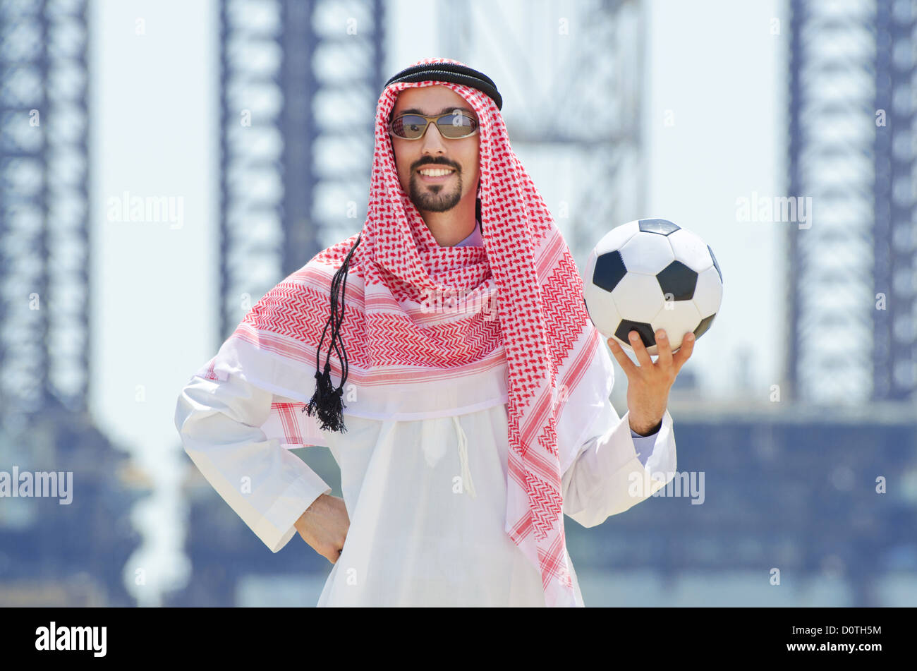 Arab with footbal at seaside Stock Photo - Alamy
