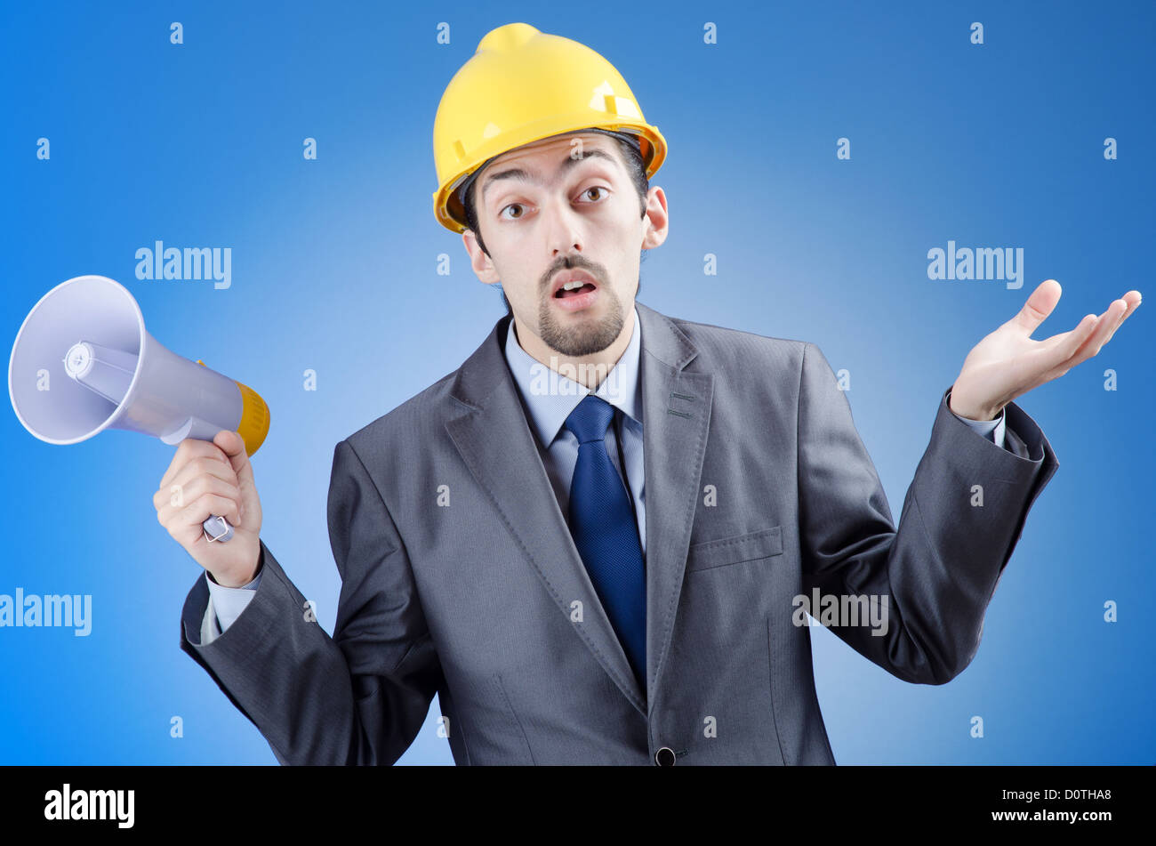 Construction worker shouting via loudspeaker Stock Photo - Alamy