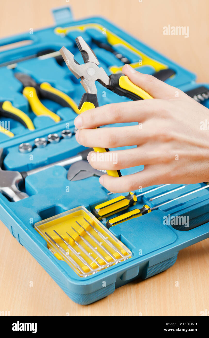 Repairman with his toolkit Stock Photo - Alamy