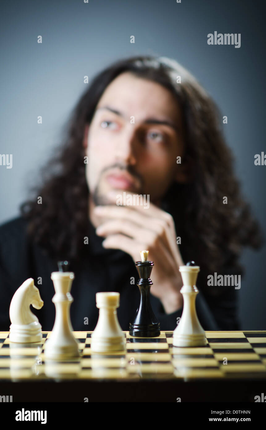 Chess player playing his game Stock Photo - Alamy