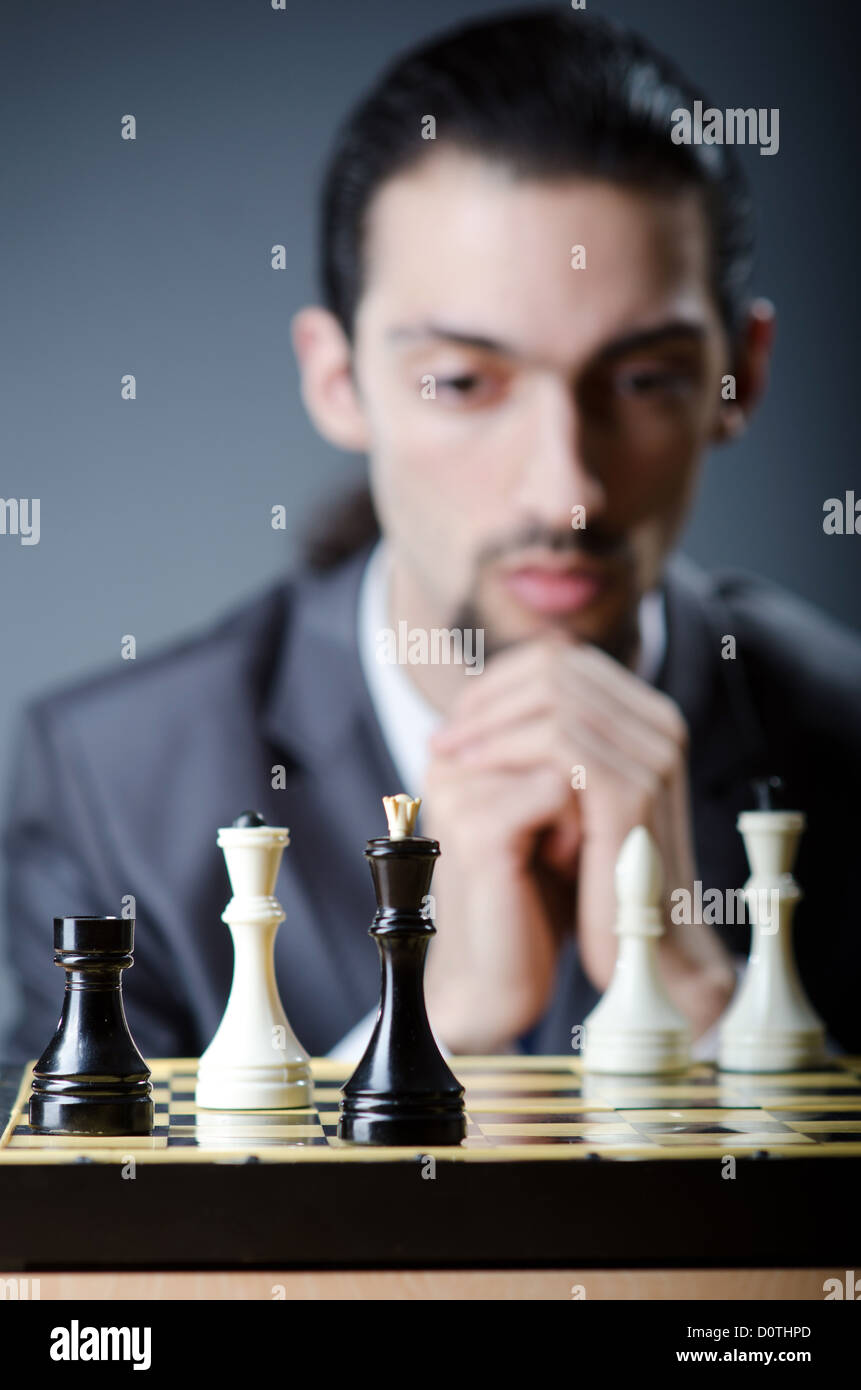 Chess player playing his game Stock Photo - Alamy