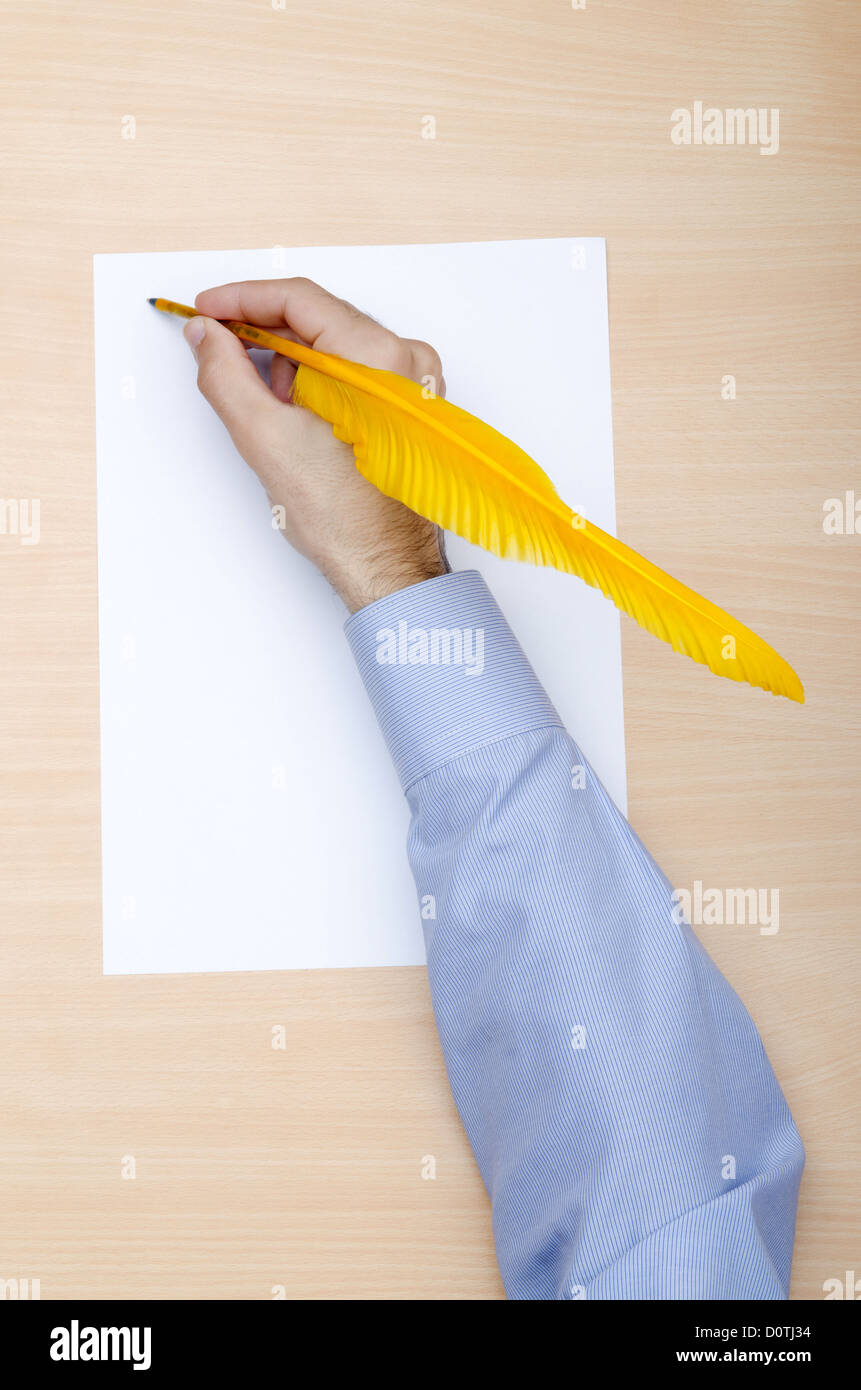 Man with quill writing Stock Photo - Alamy