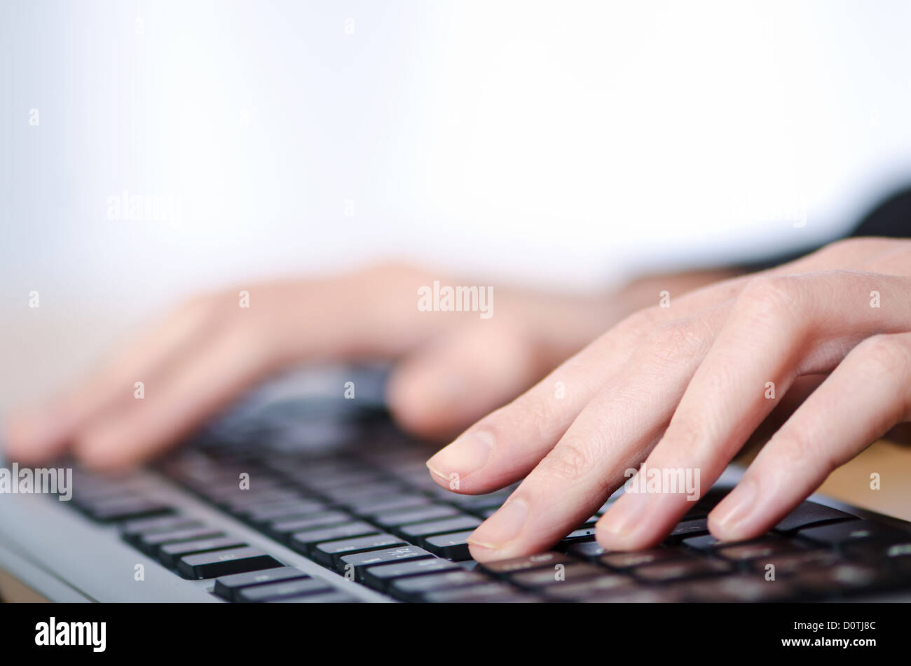 Hands typing on the keyboard Stock Photo - Alamy