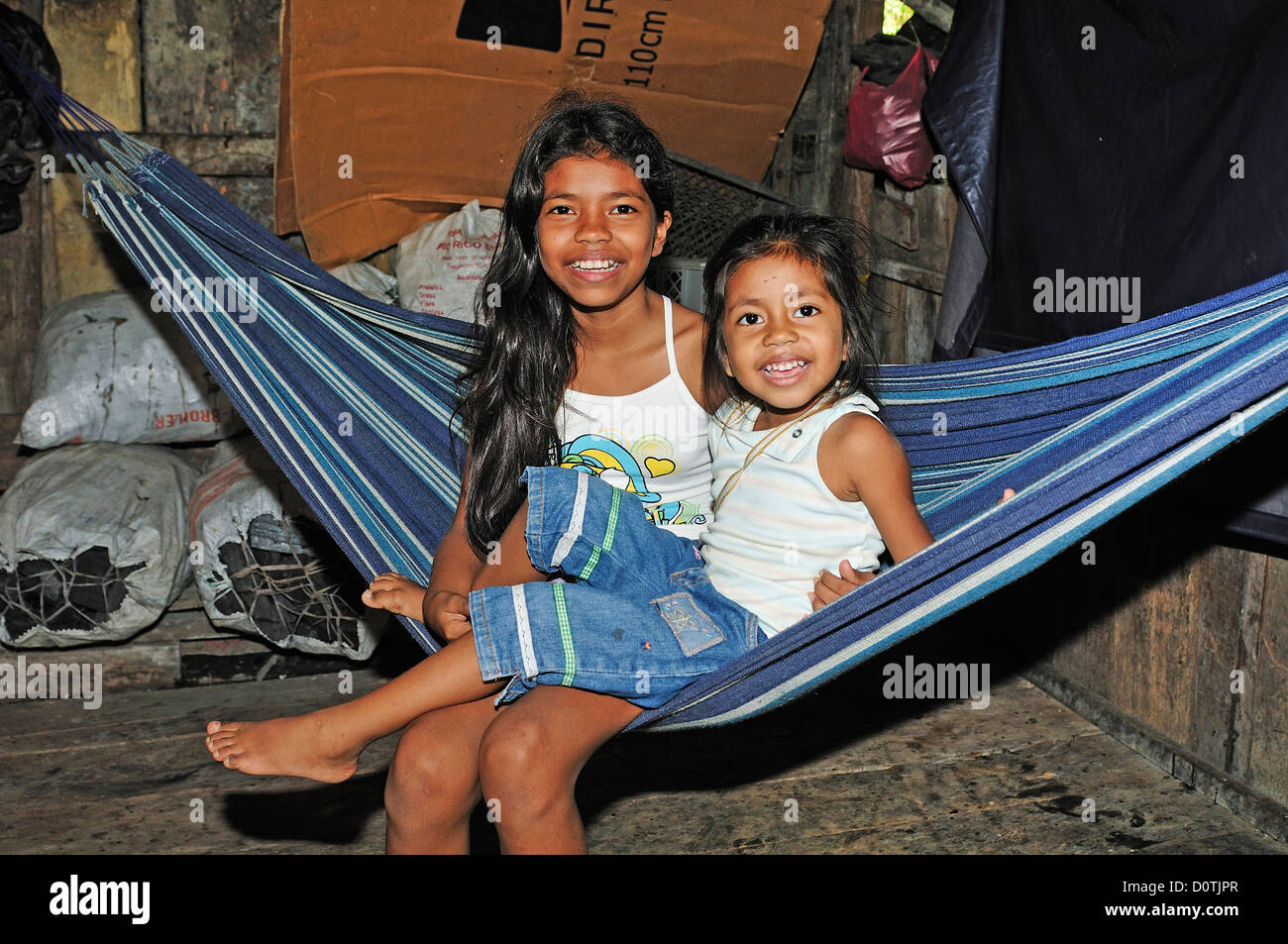 Two, local, girls, lounging, hammock, waterfront, Amazonas, Leticia ...