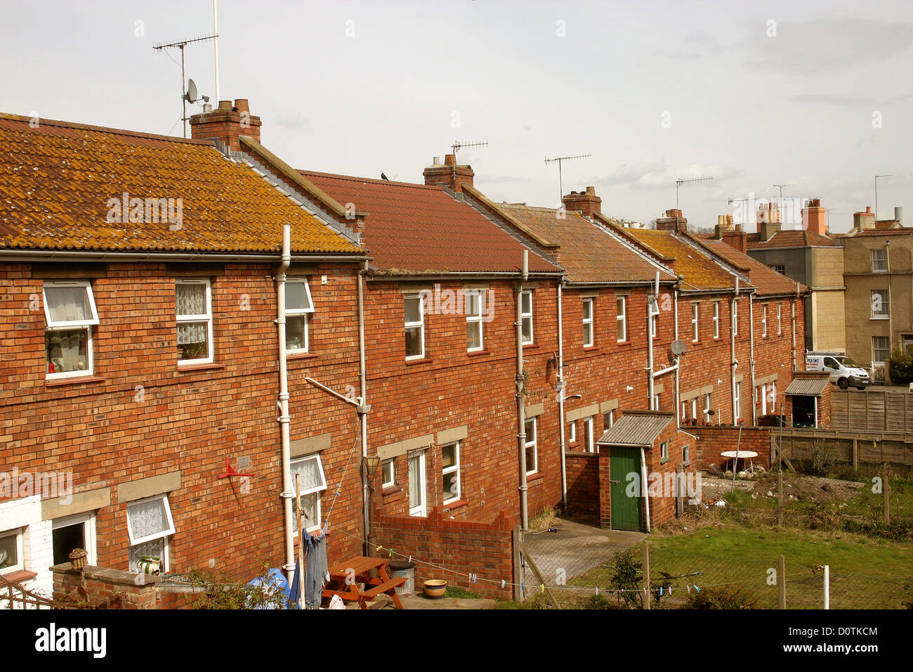 View along the back of a row of 1950's English urban housing Stock ...