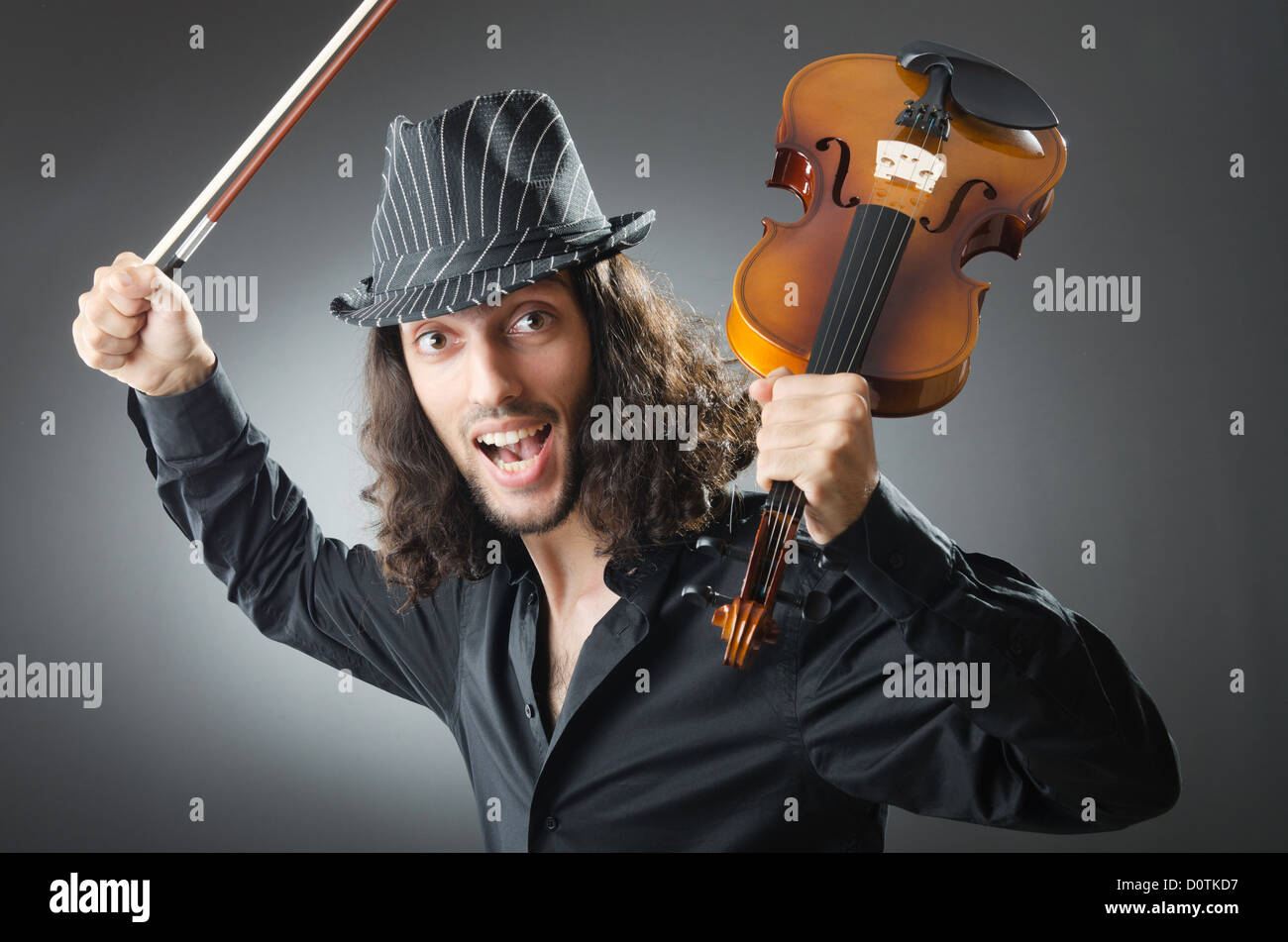 Fiddler playing the violin Stock Photo - Alamy