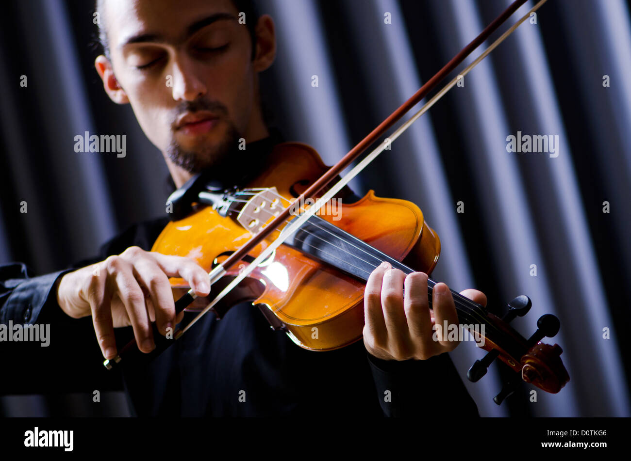 Young violin player playing Stock Photo - Alamy