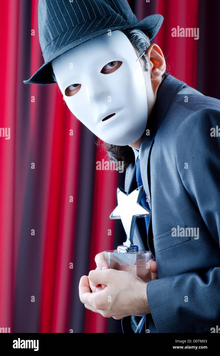 Man receiving award in mask Stock Photo - Alamy