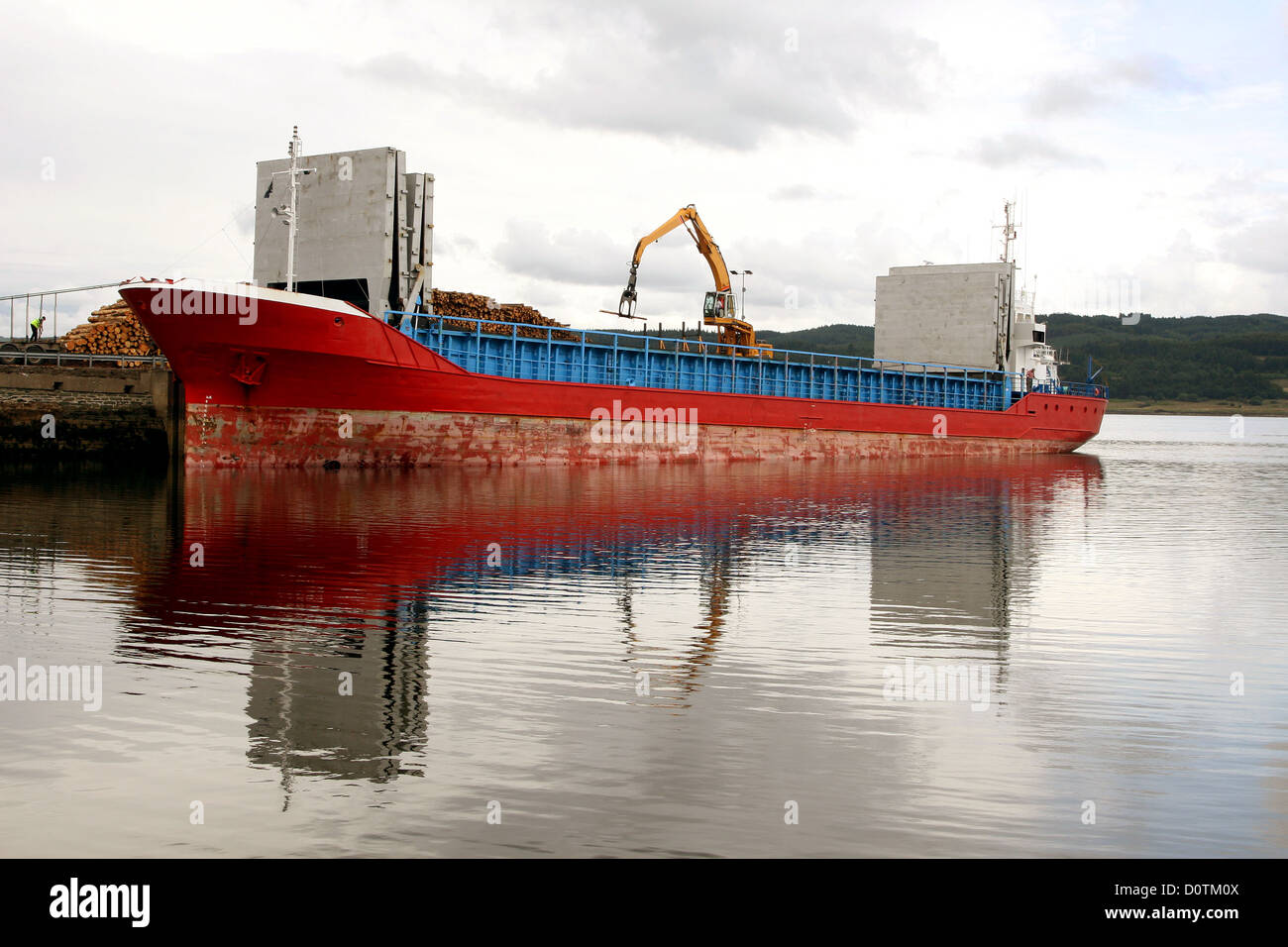 Cargo ship loading logs in a Scottish sea loch, August 2006 Stock Photo ...
