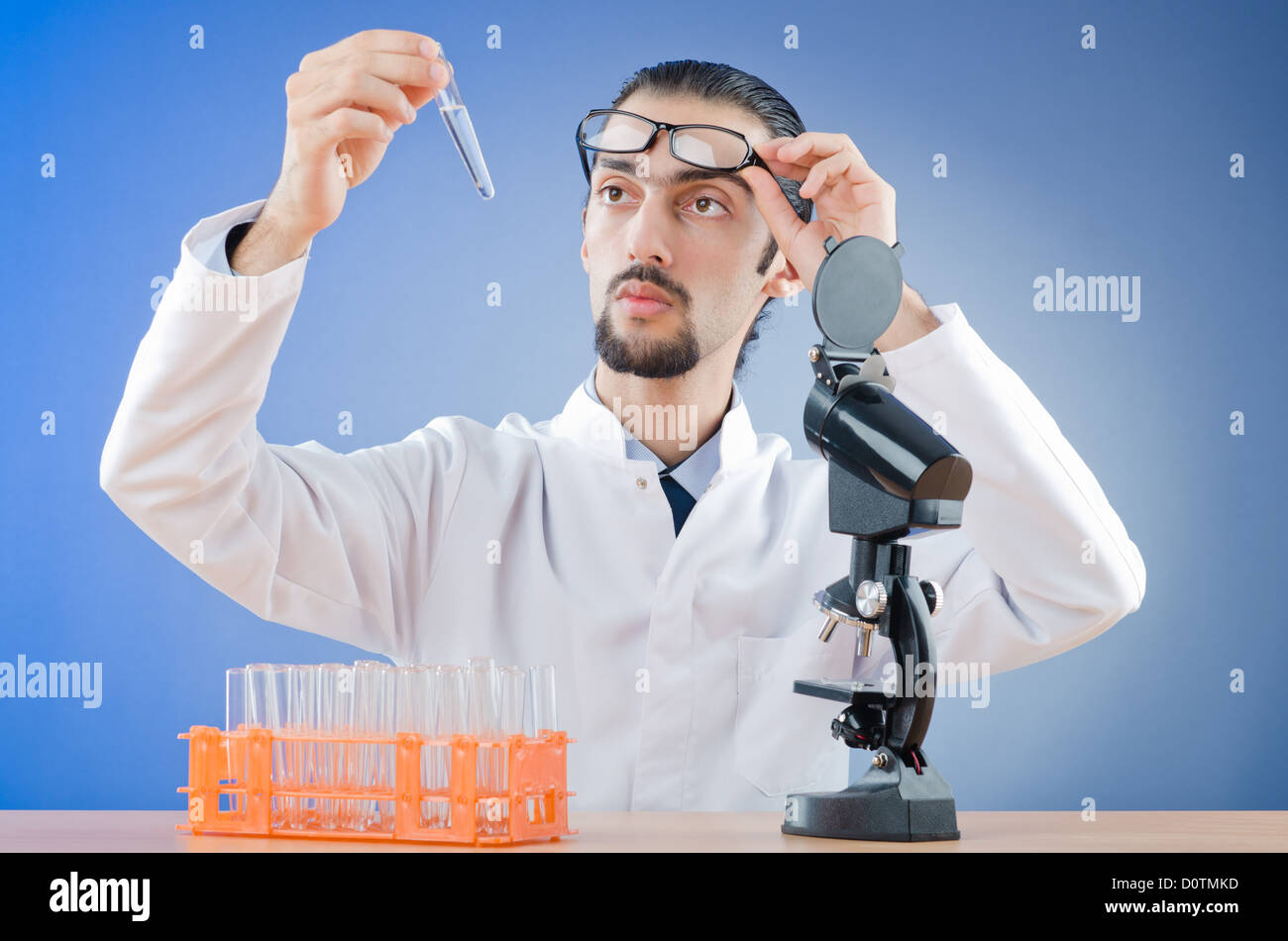 Chemist working with microscope Stock Photo - Alamy
