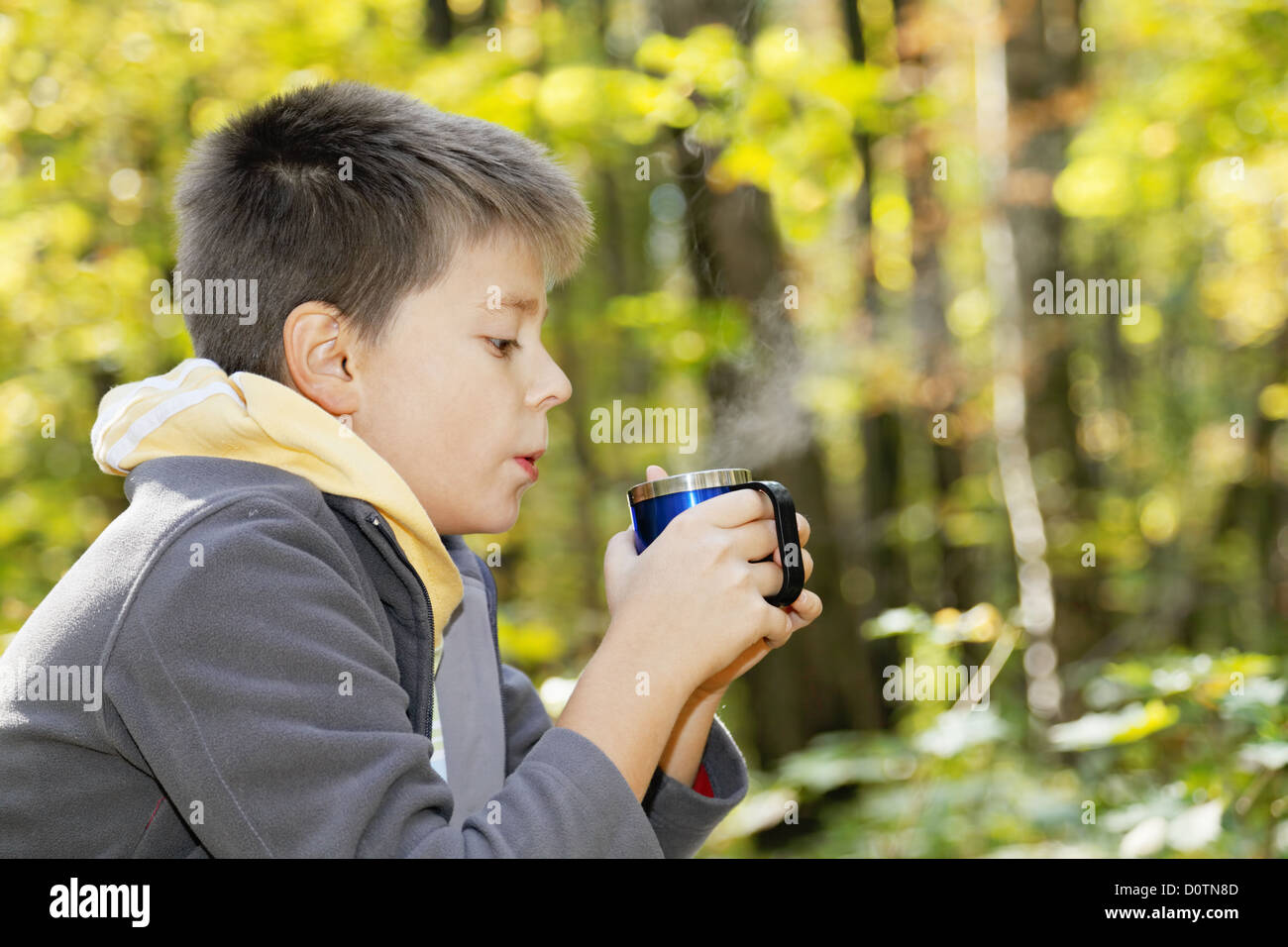 Boy cools tea Stock Photo - Alamy