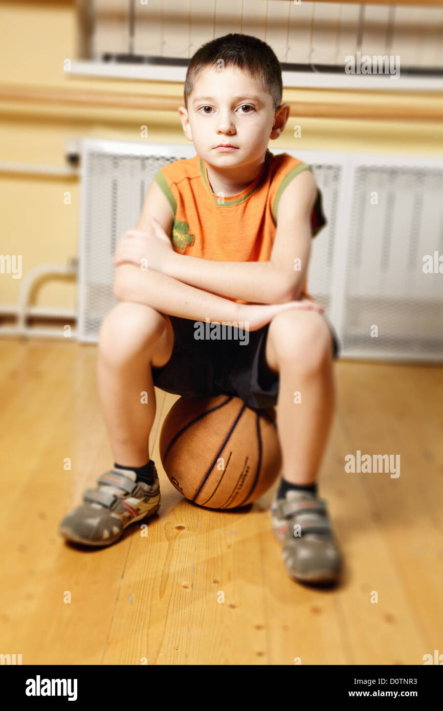 Boy on basketball Stock Photo - Alamy