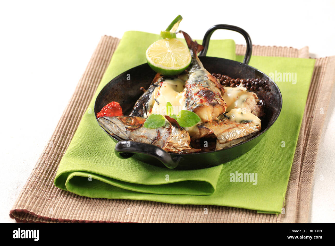 Pan fried mackerel topped with cheese Stock Photo - Alamy