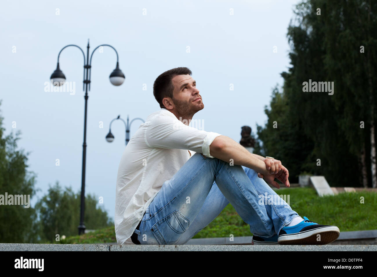 sad man relax in summer city park Stock Photo - Alamy