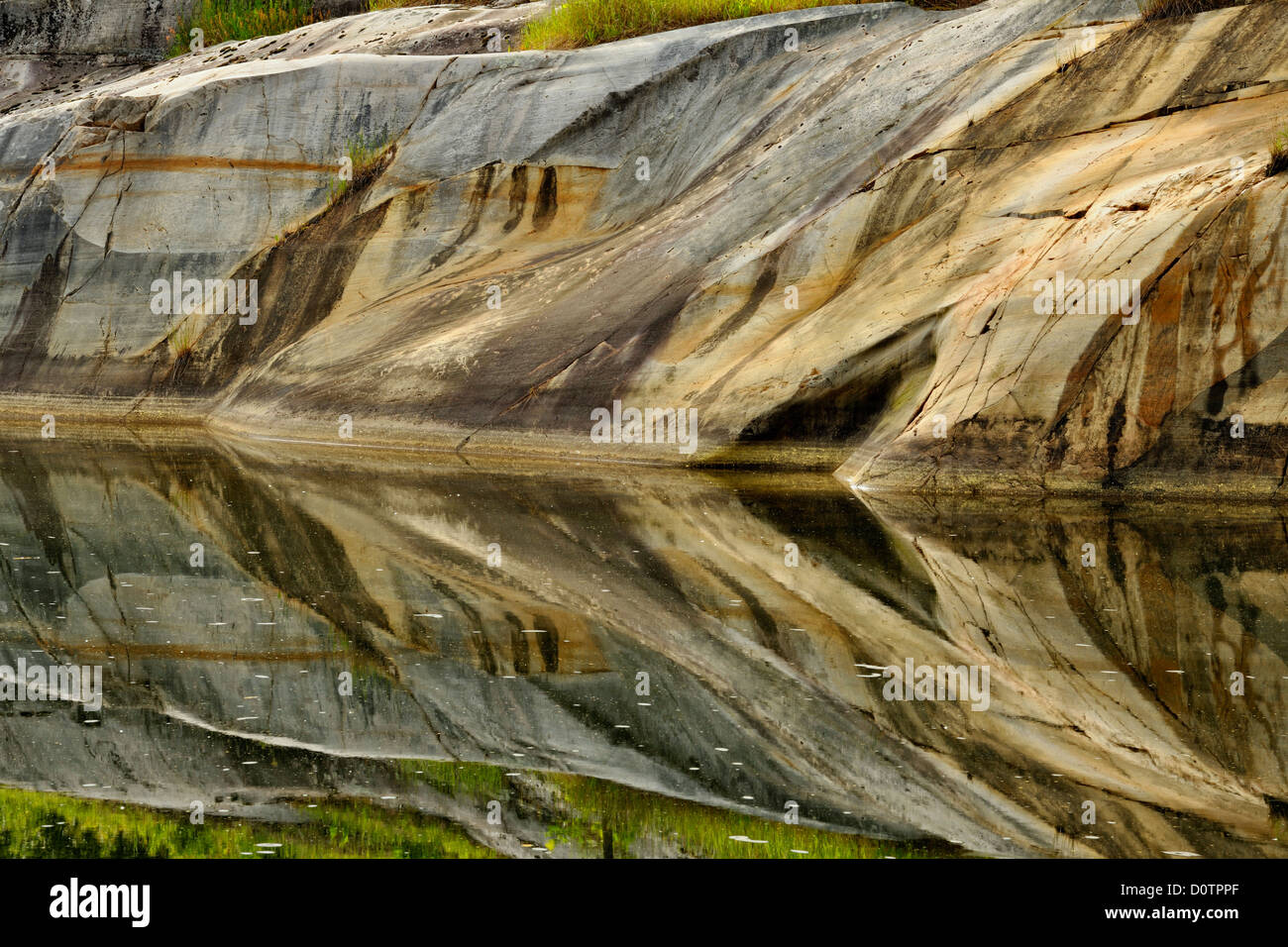 Rock outcrops reflected in the Whitefish River, Whitefish Falls ...