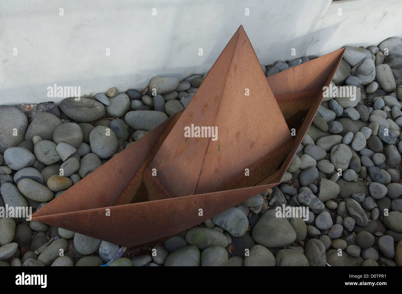 metal boat in sea of stones Stock Photo - Alamy