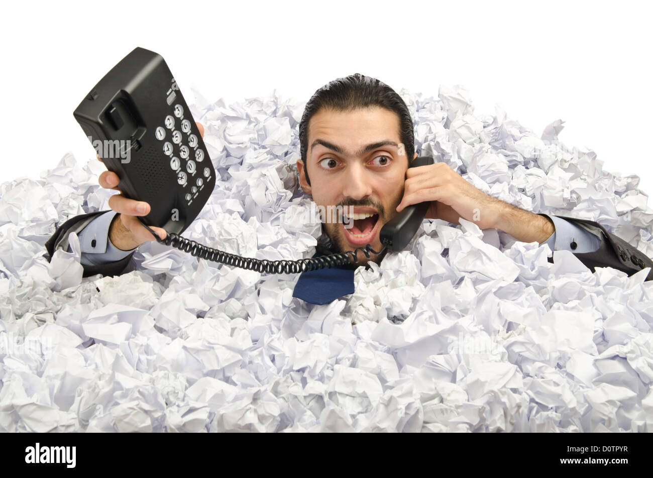 Man with lots of waste paper Stock Photo - Alamy