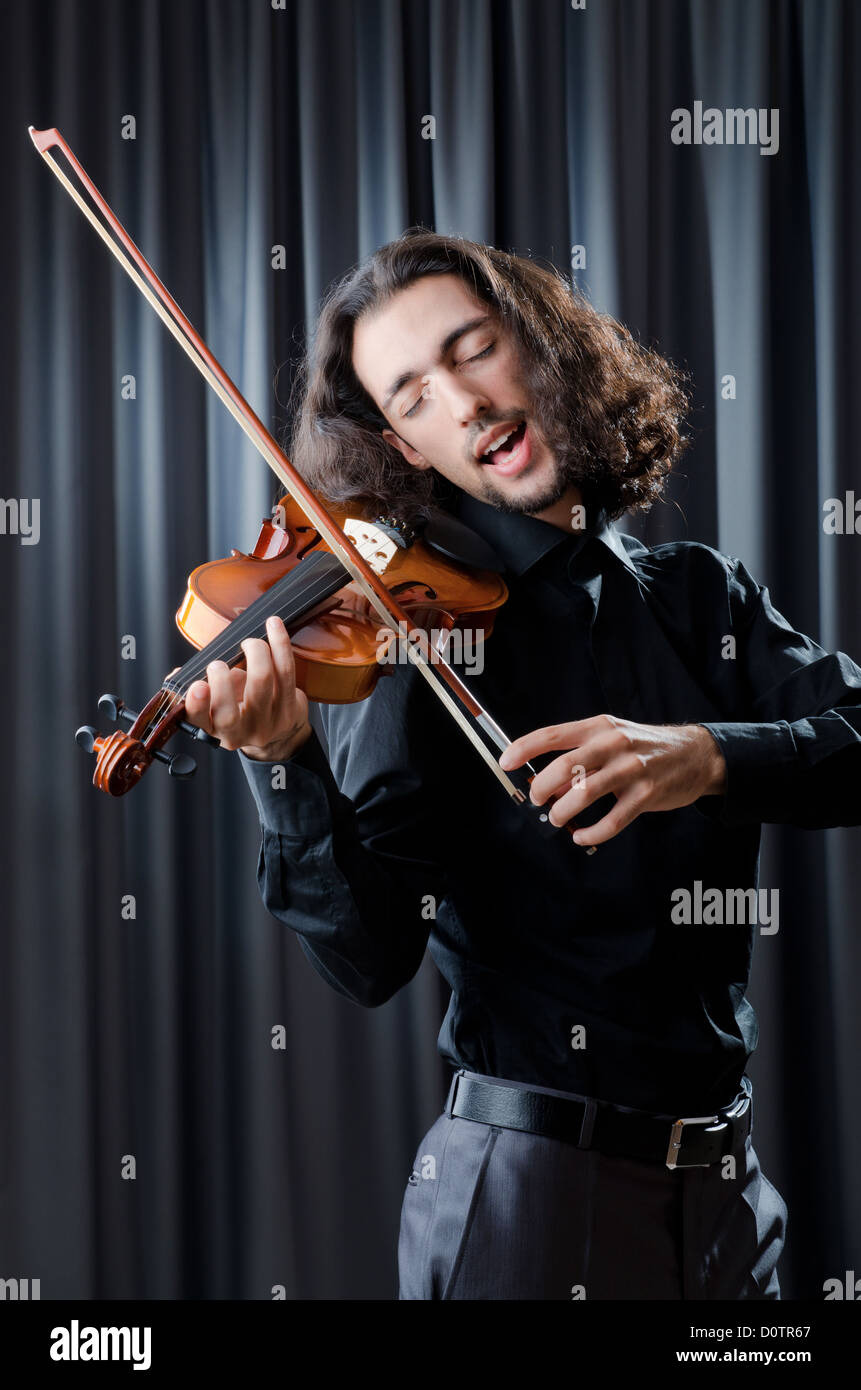 Violin player playing the intstrument Stock Photo - Alamy