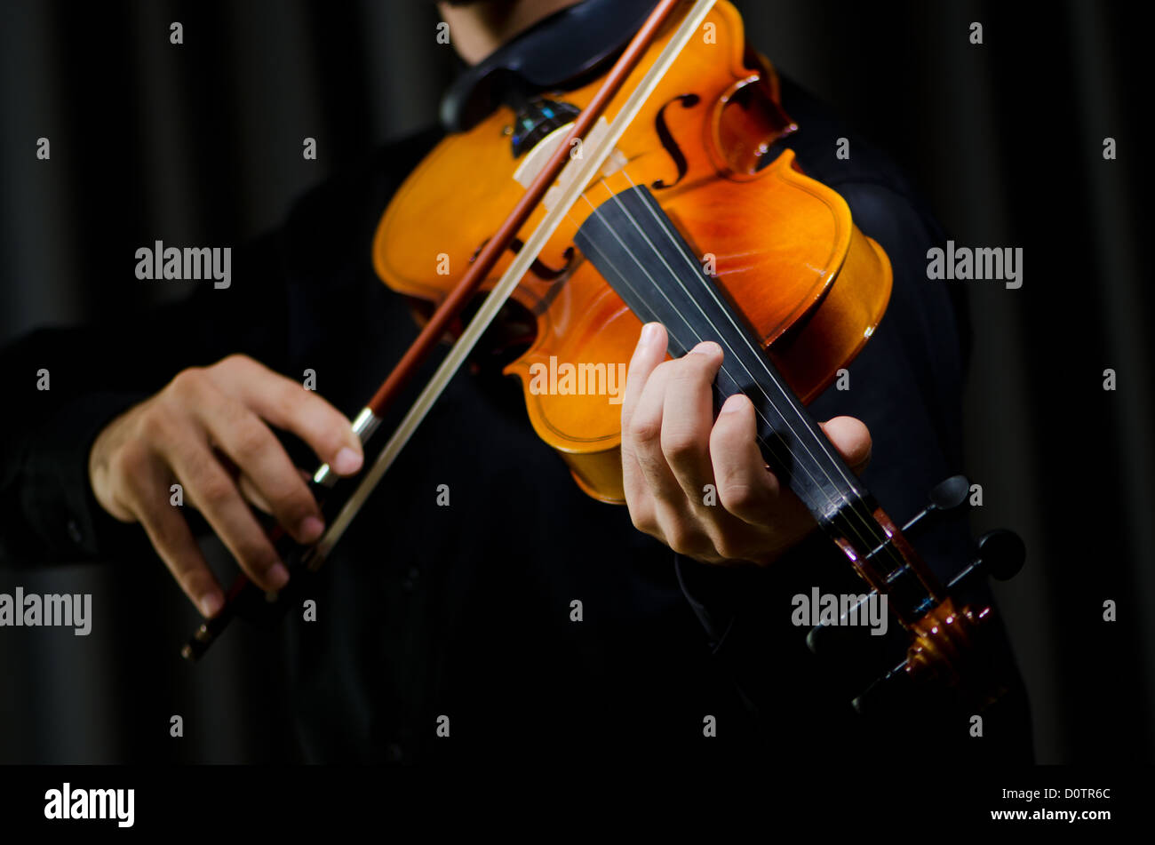 Young violin player playing Stock Photo - Alamy