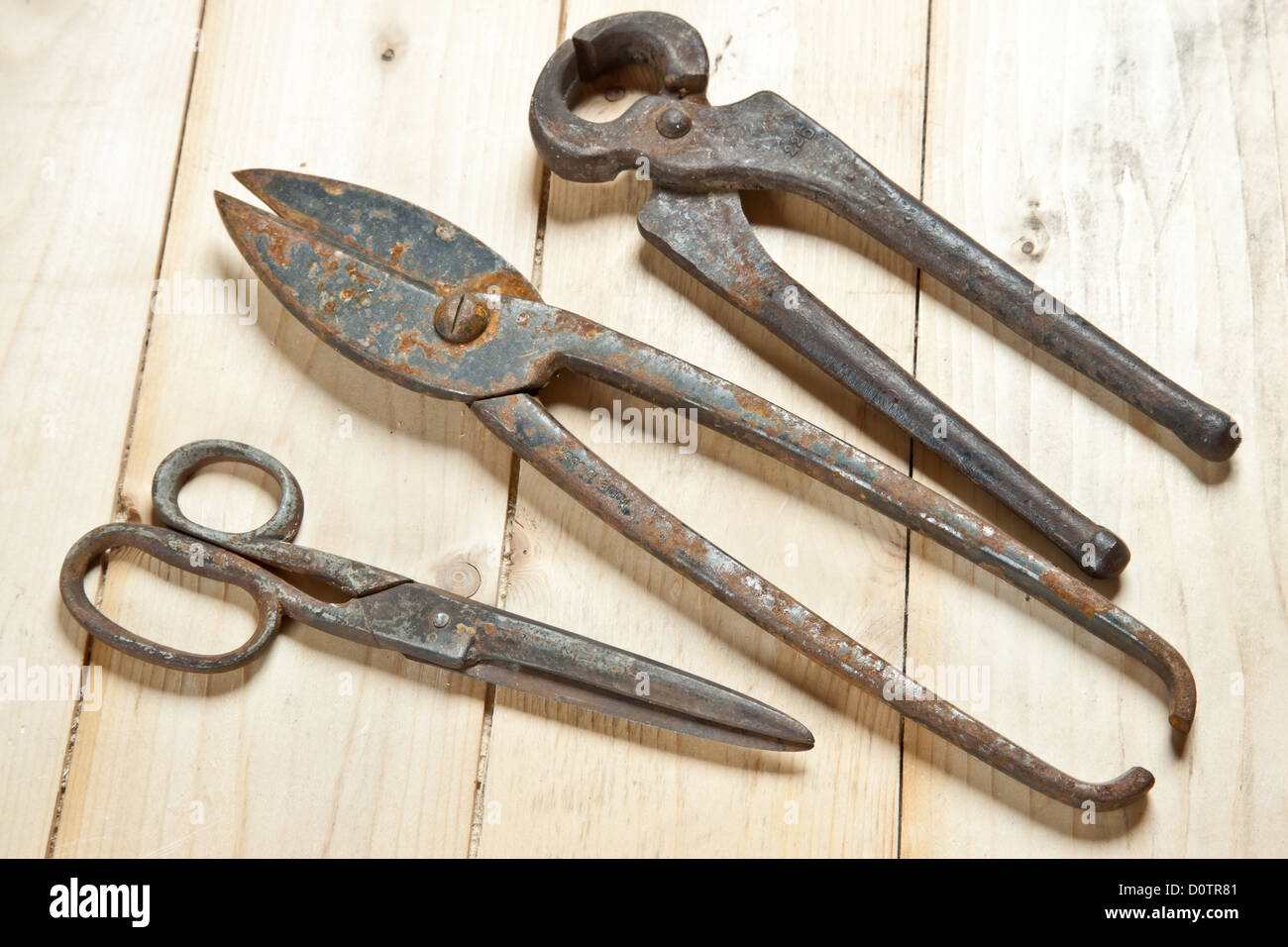 nippers on wood background Stock Photo - Alamy