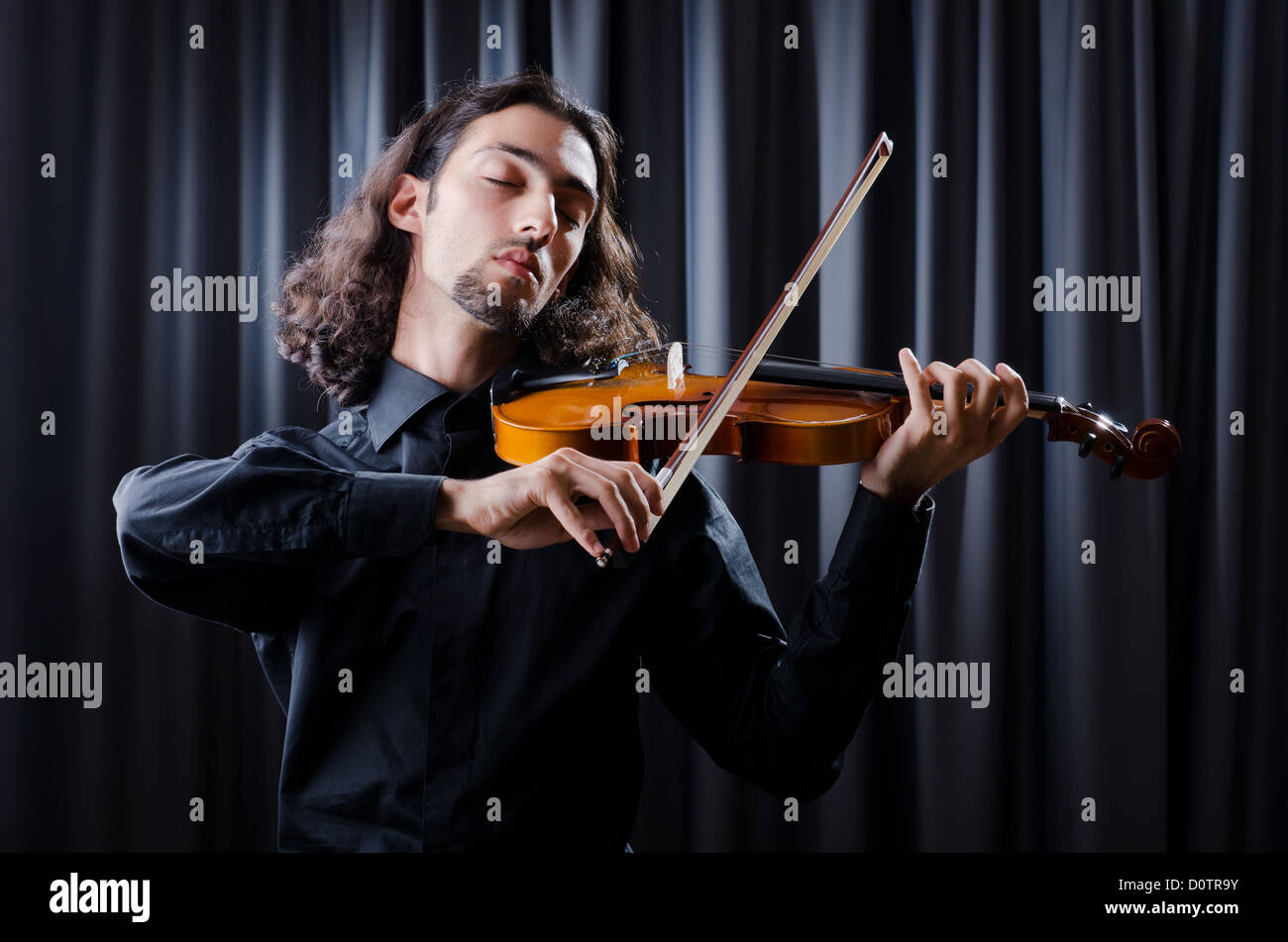 Young violin player playing Stock Photo - Alamy