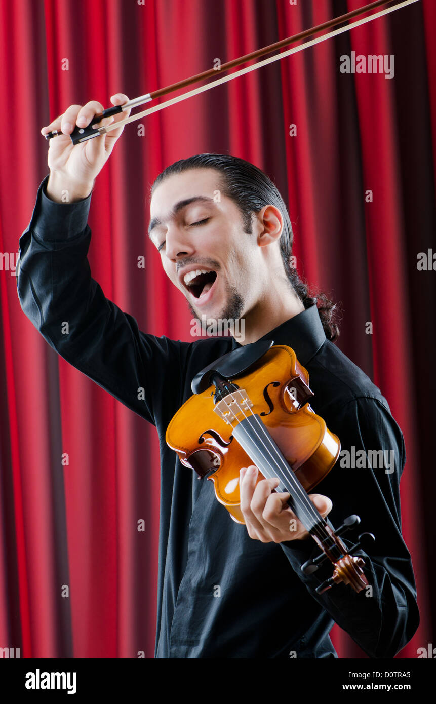 Young violin player playing Stock Photo - Alamy