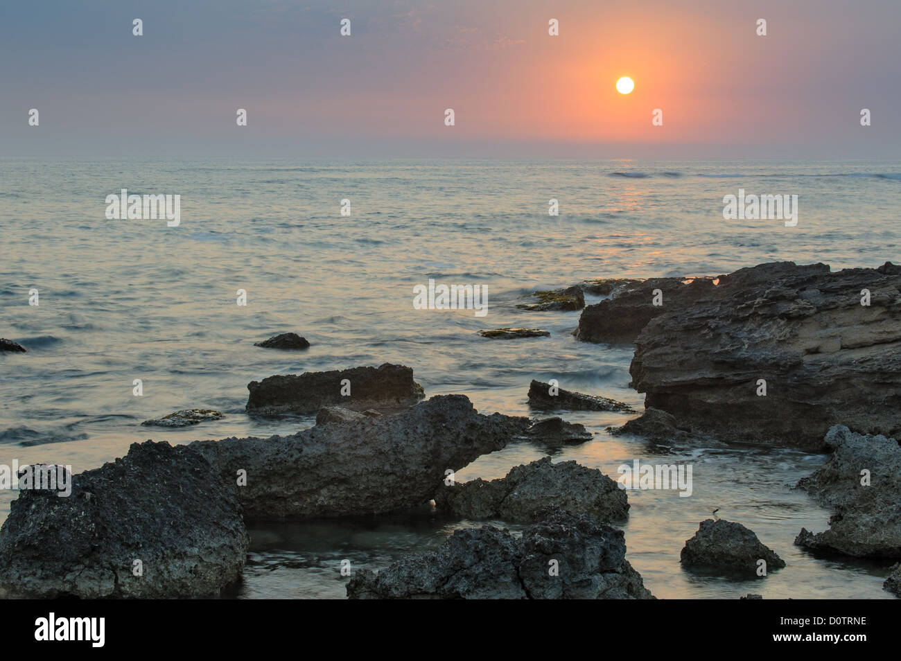 Golden sunset over ocean rock hi-res stock photography and images - Alamy