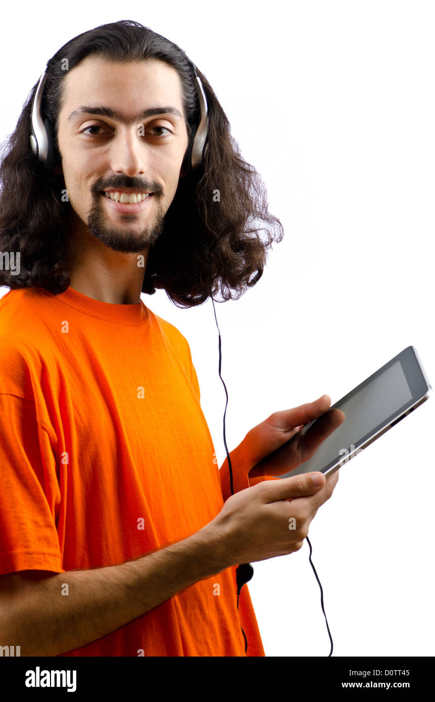 Student listening music with tablet computer Stock Photo - Alamy