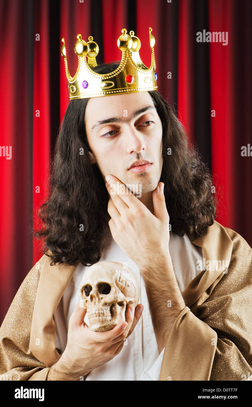 Funny king against red curtain Stock Photo - Alamy