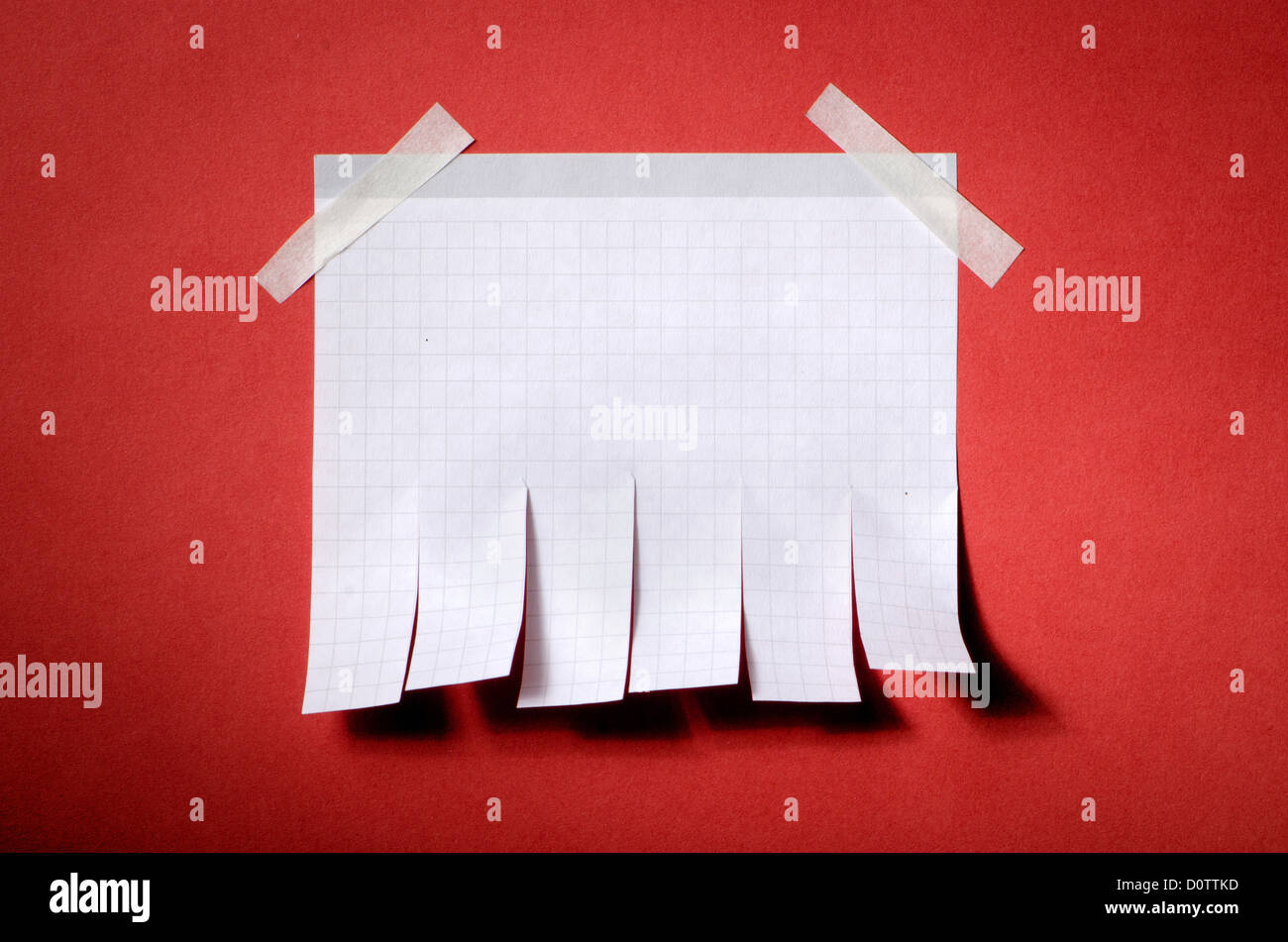 Tear off paper notice on the wall Stock Photo - Alamy