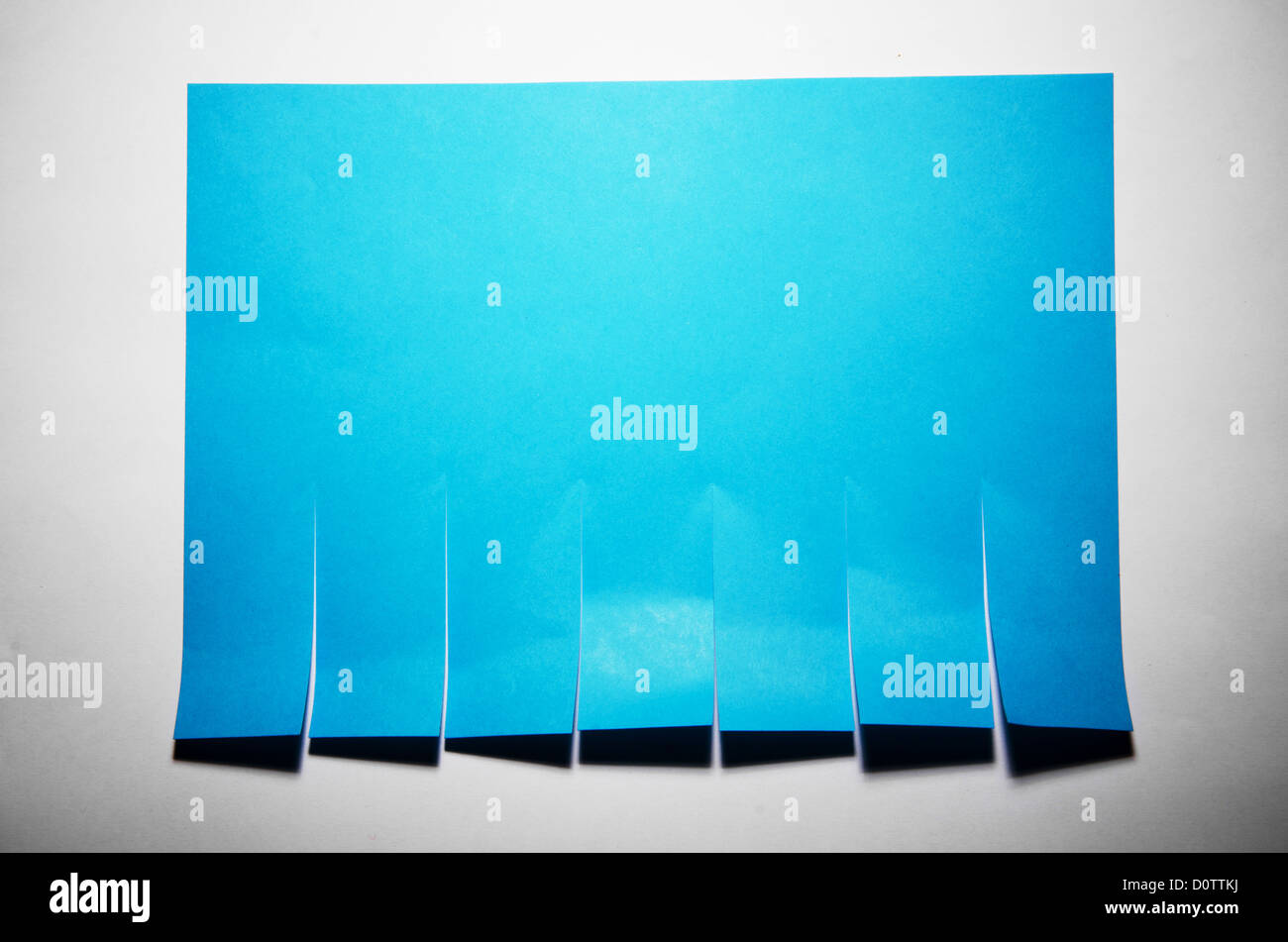 Tear off paper notice on the wall Stock Photo - Alamy