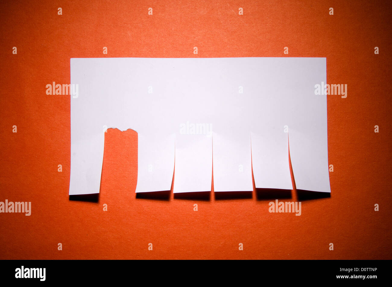 Tear off paper notice on the wall Stock Photo - Alamy