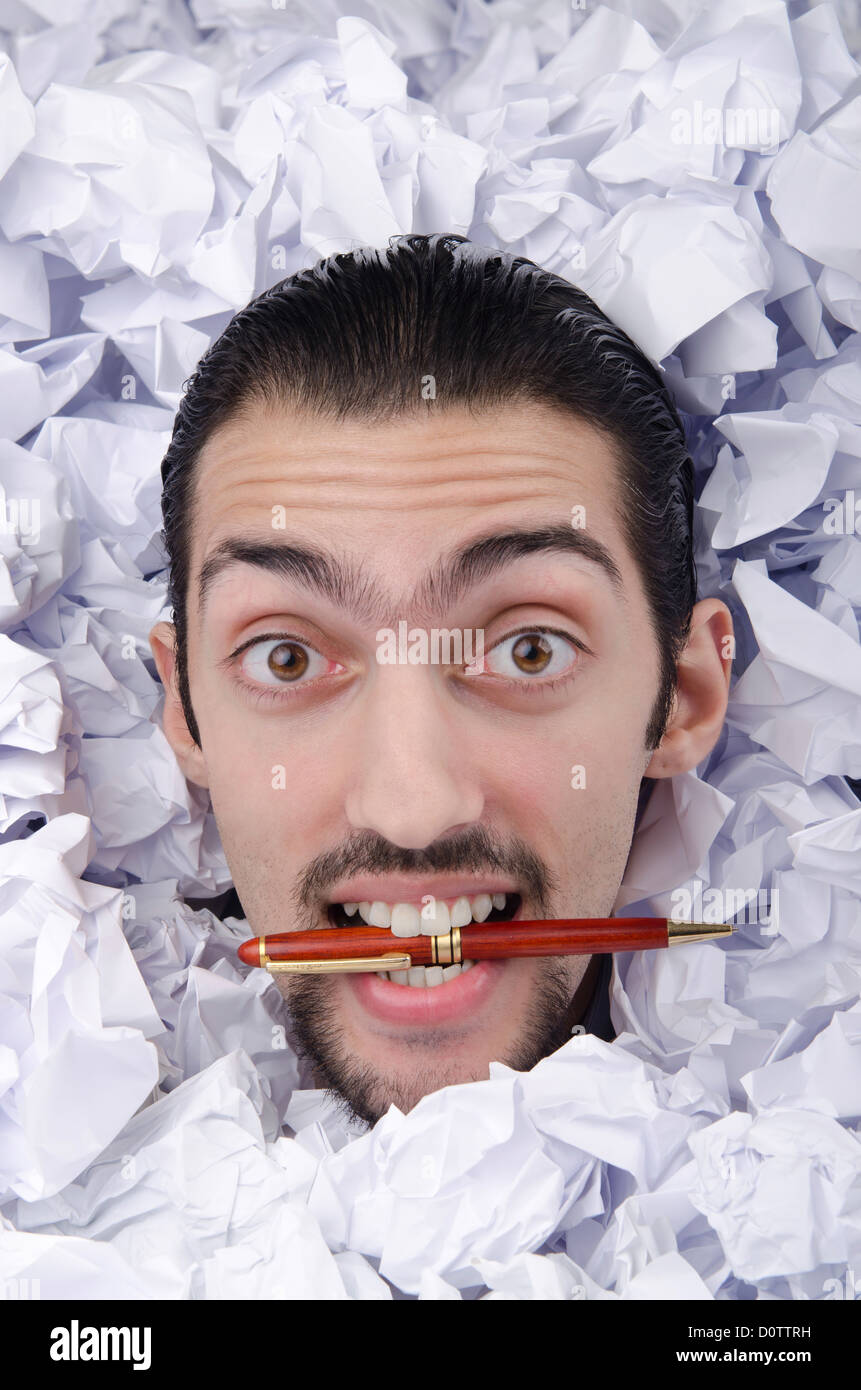 Man with lots of crumpled paper Stock Photo - Alamy