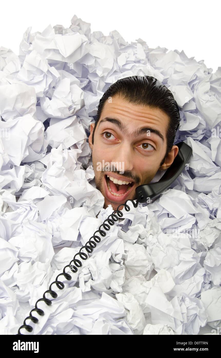 Man with lots of crumpled paper Stock Photo - Alamy