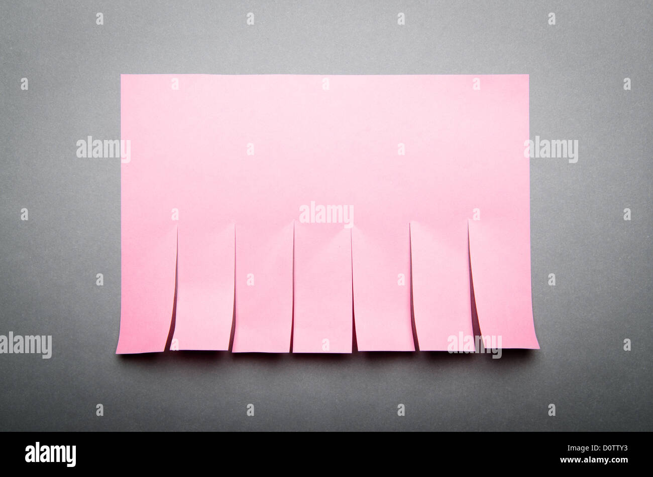 Tear off paper notice on the wall Stock Photo - Alamy