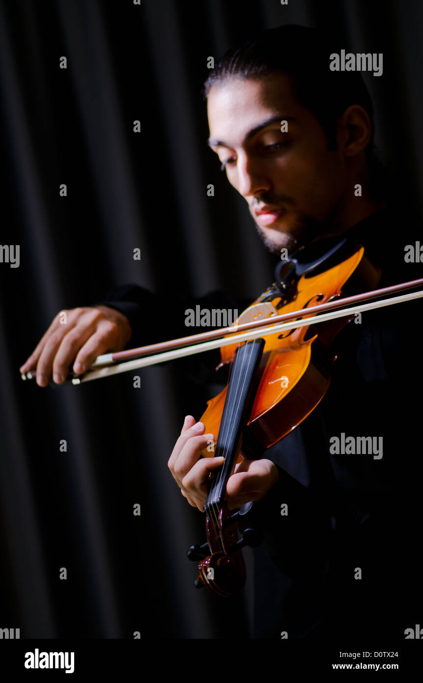 Young violin player playing Stock Photo - Alamy