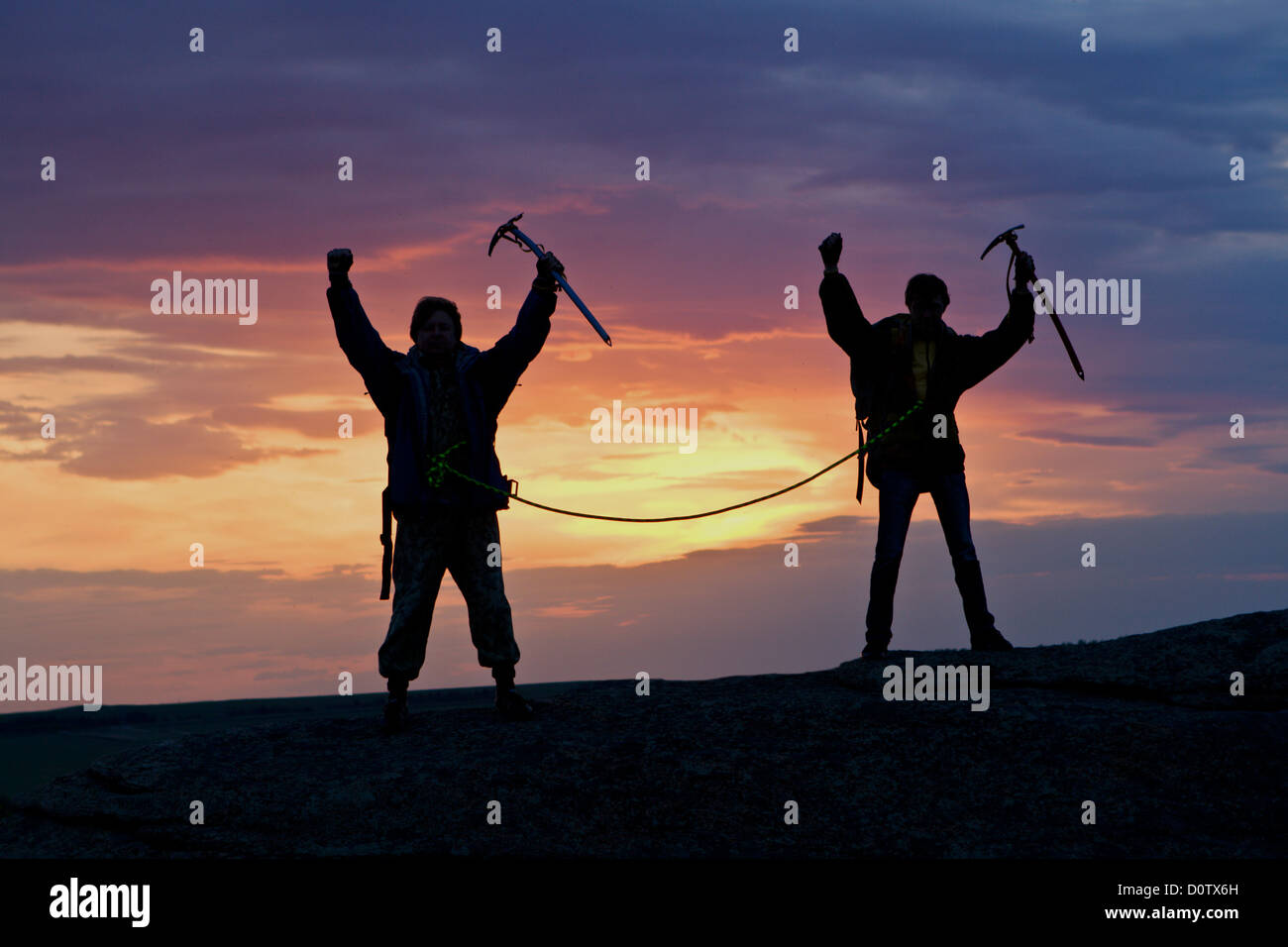 Two climbers connected by rope Stock Photo - Alamy