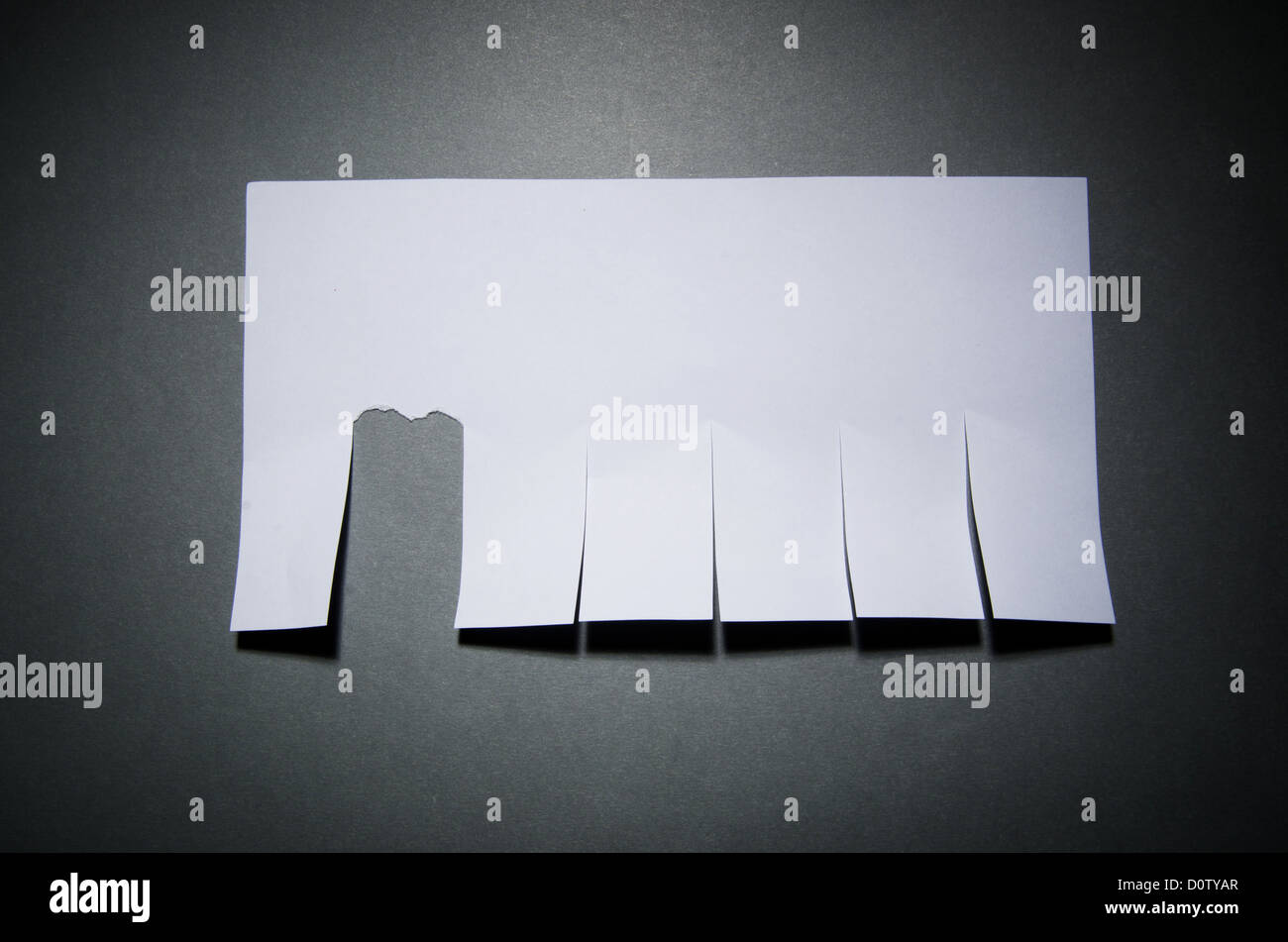 Tear off paper notice on the wall Stock Photo - Alamy