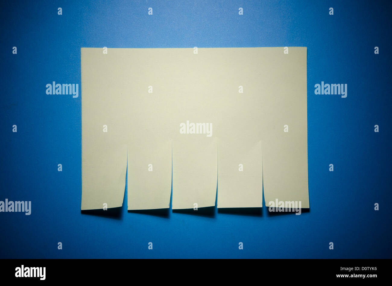 Tear off paper notice on the wall Stock Photo - Alamy