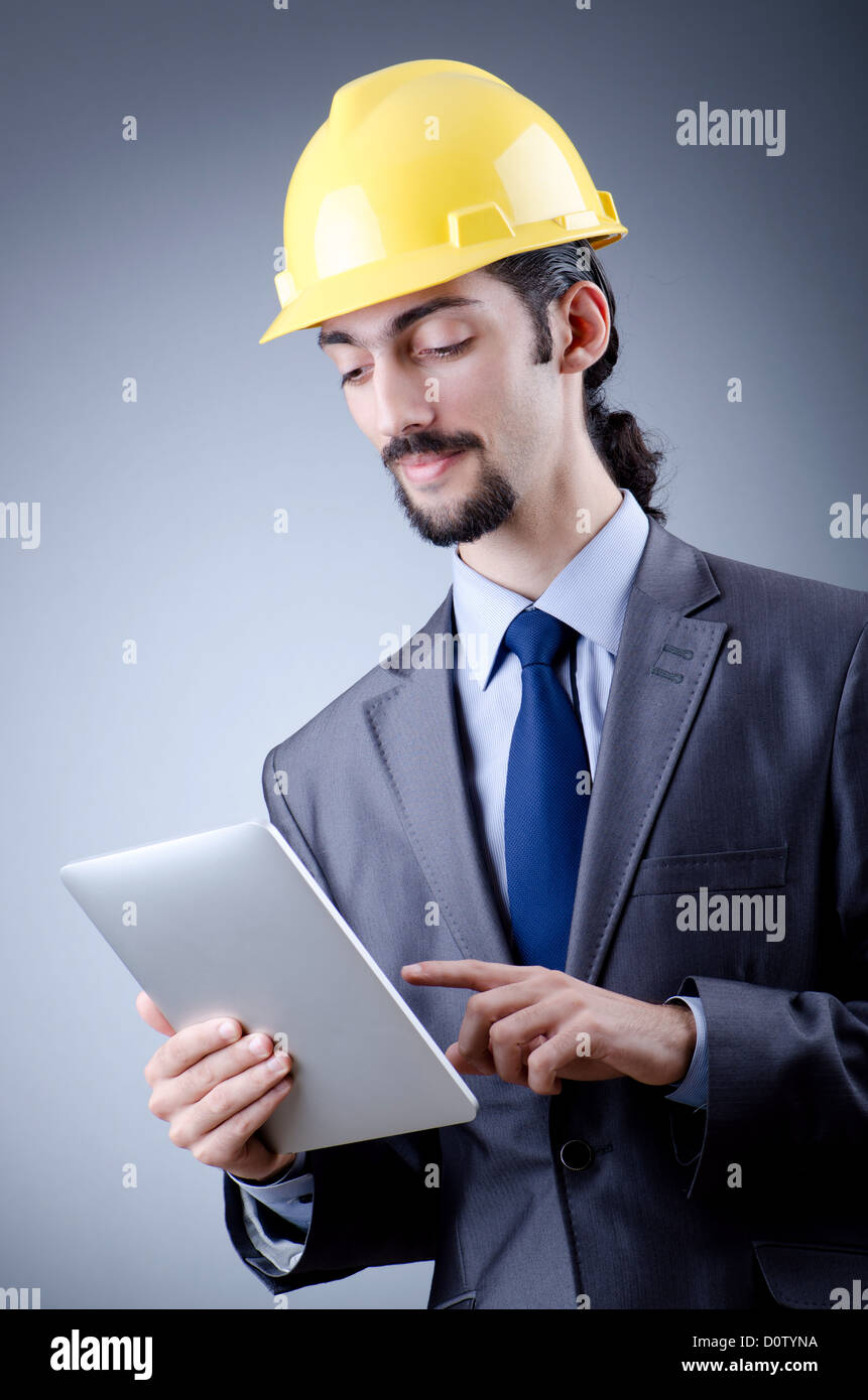 Construction worker working on tablet Stock Photo - Alamy