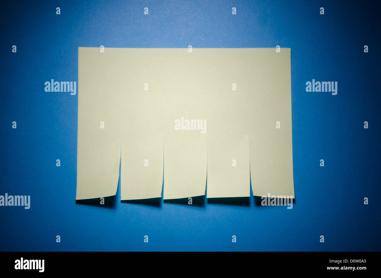Tear off paper notice on the wall Stock Photo - Alamy