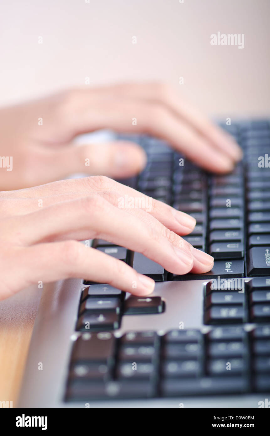 Hands typing on the keyboard Stock Photo - Alamy