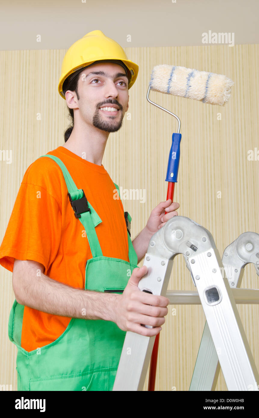 Painter worker during painting job Stock Photo - Alamy
